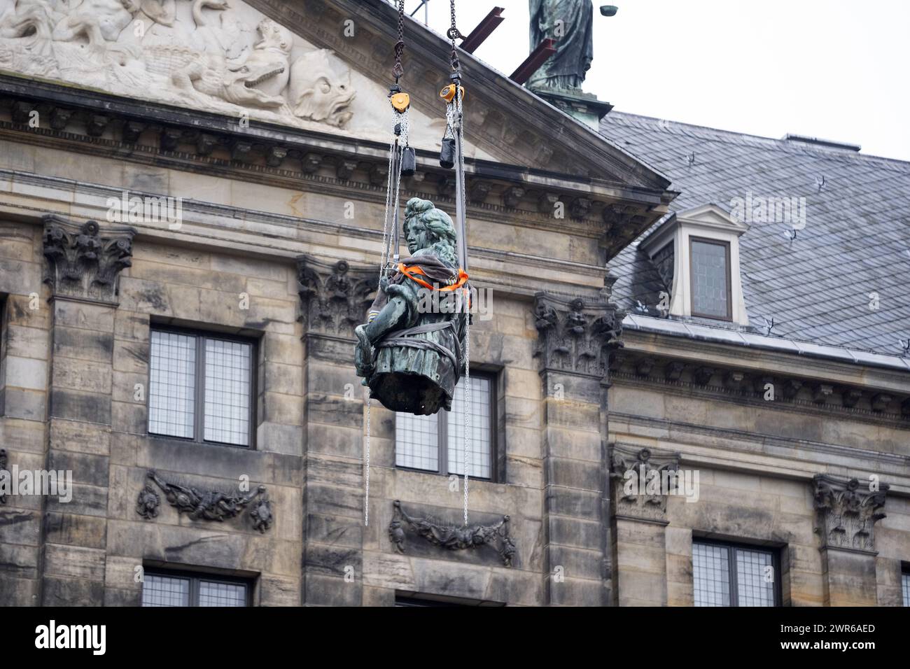 AMSTERDAM - The bronze statue of Caution is removed from the roof of ...