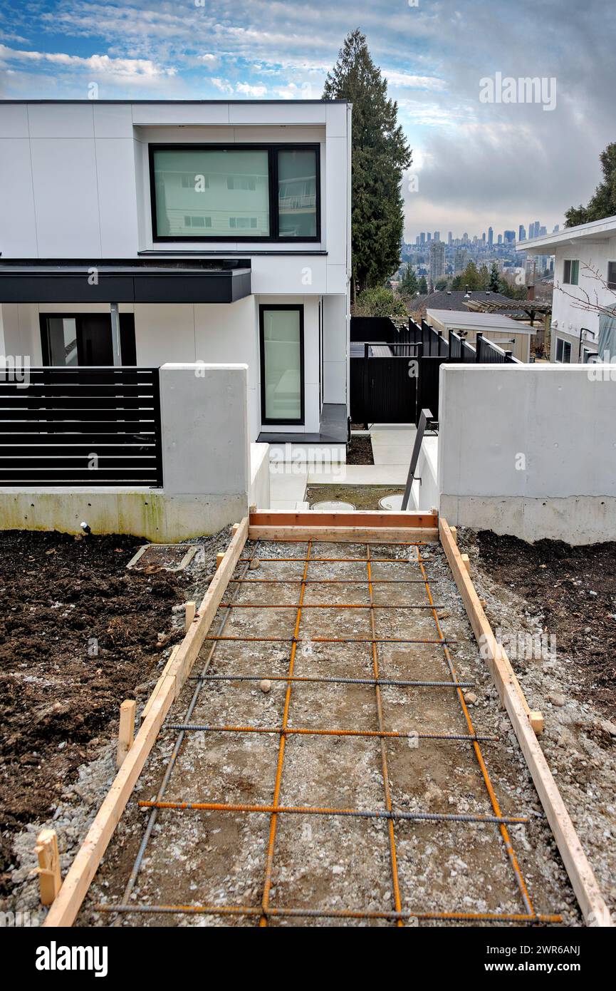 Pathway construction to the main entrance of brand new family house in ...
