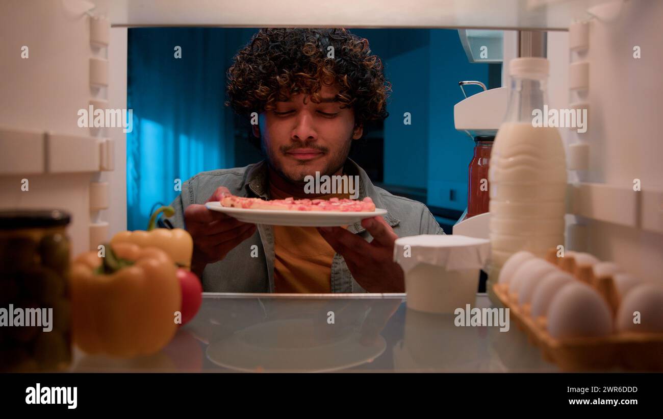 Man eating out of fridge hi-res stock photography and images - Alamy