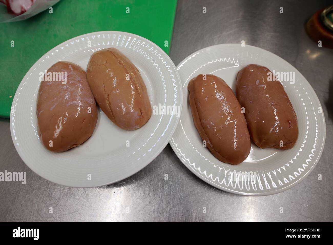 Tanne, Germany. 11th Mar, 2024. Bull testicles lie in a bowl in ...