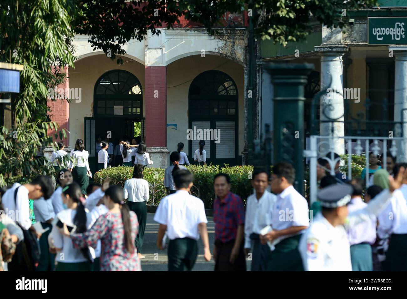 Yangon, Myanmar. 11th Mar, 2024. Students enter a high school for the ...