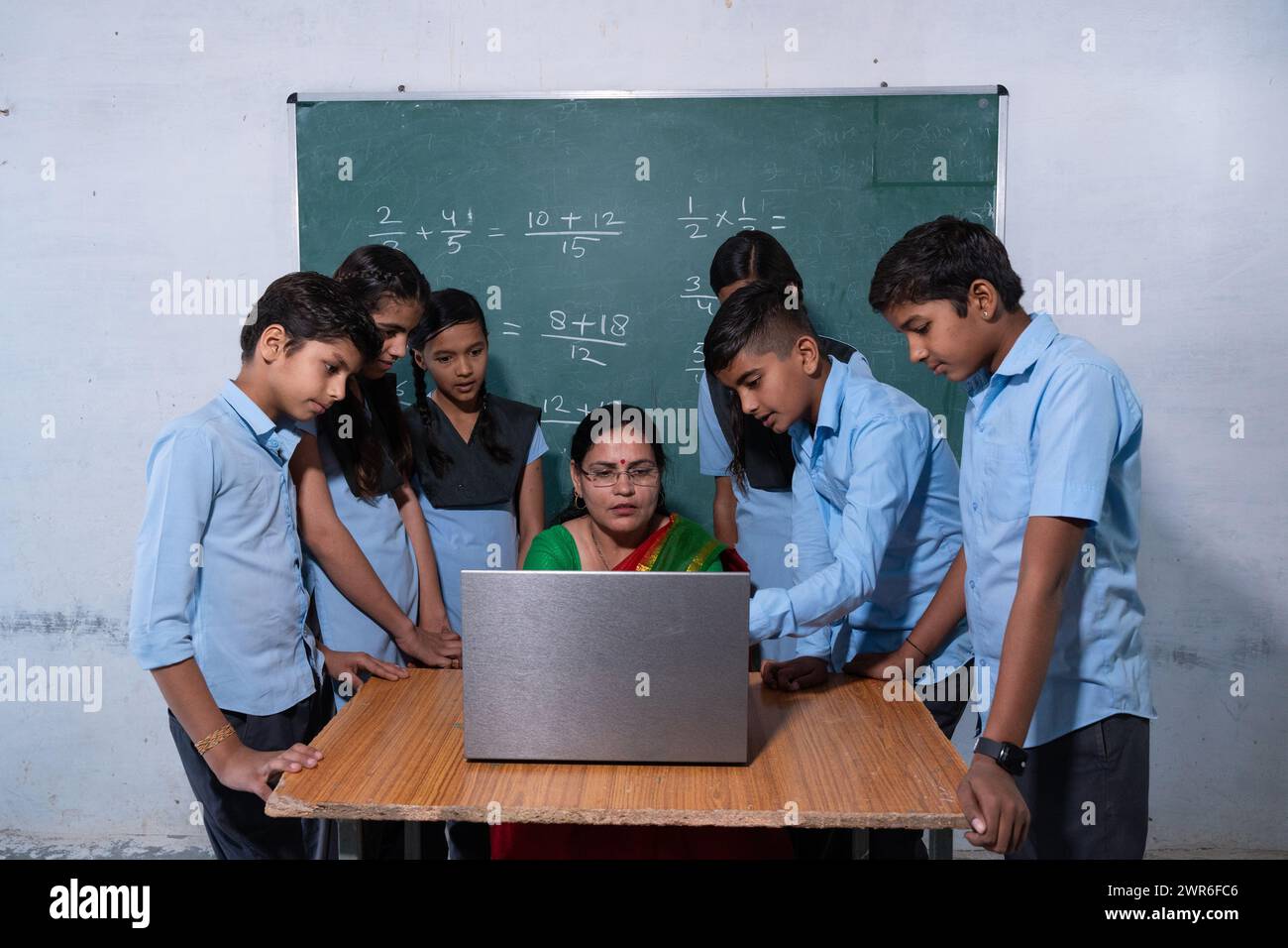 Indian rural kids and female teacher teaching in classroom hi-res stock ...