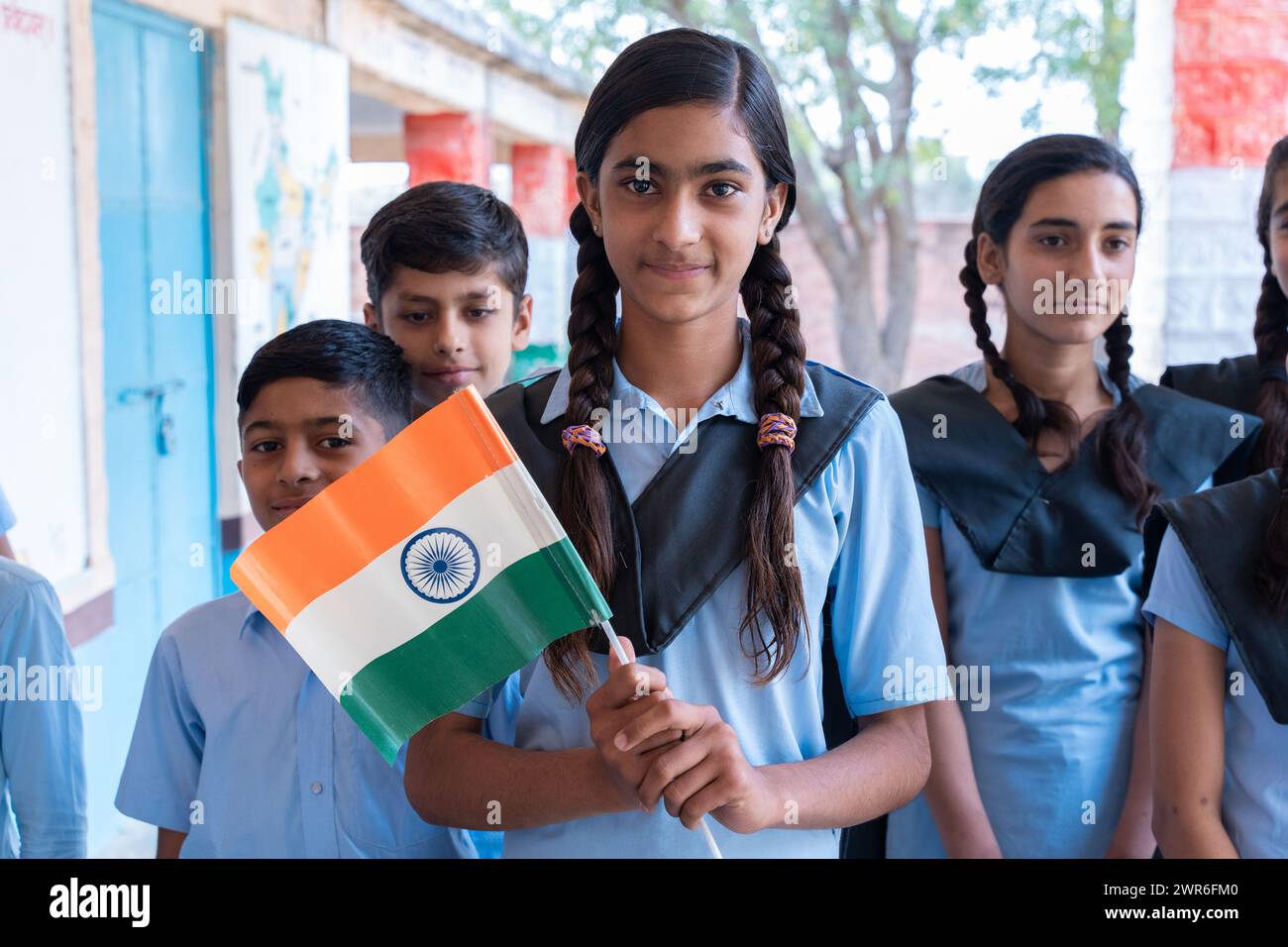 Group of happy village children in school uniform celebrating ...