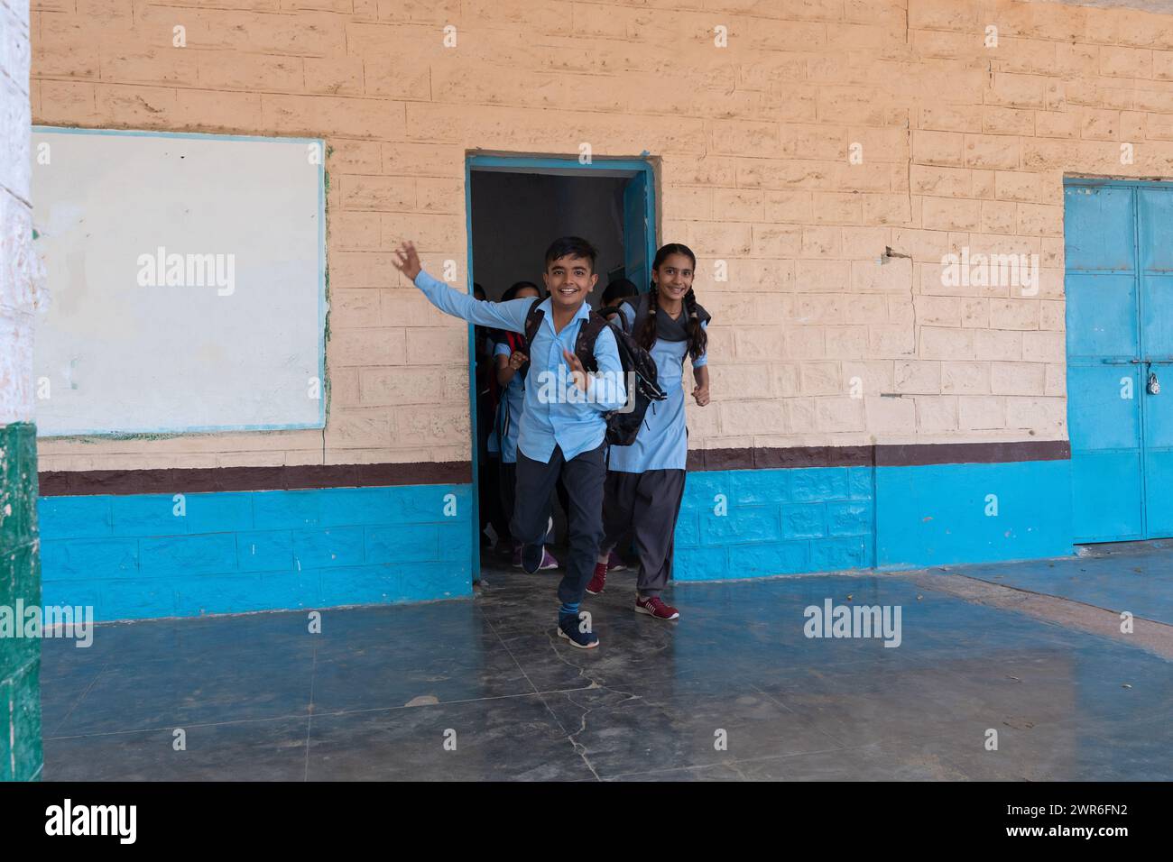 Group indian rural children in school uniform running in school ...