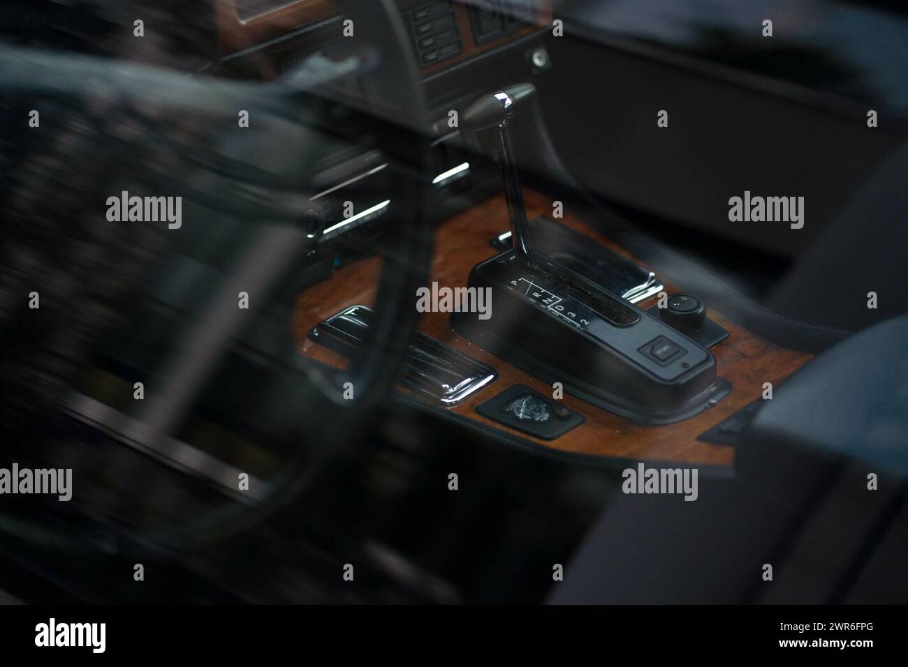 Interior of empty vehicle with visible driver's manual and controls ...