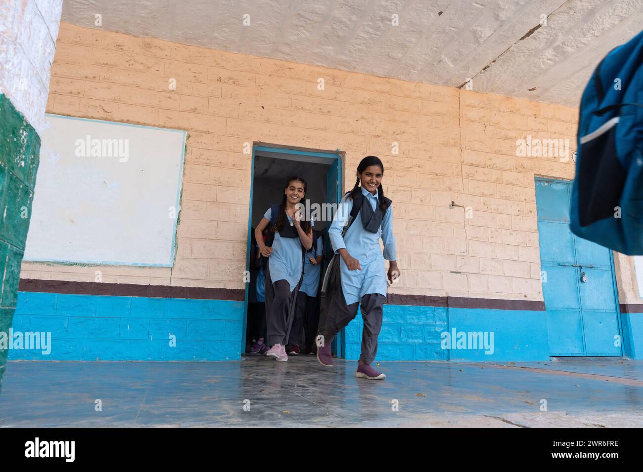 Group indian rural children in school uniform running in school ...