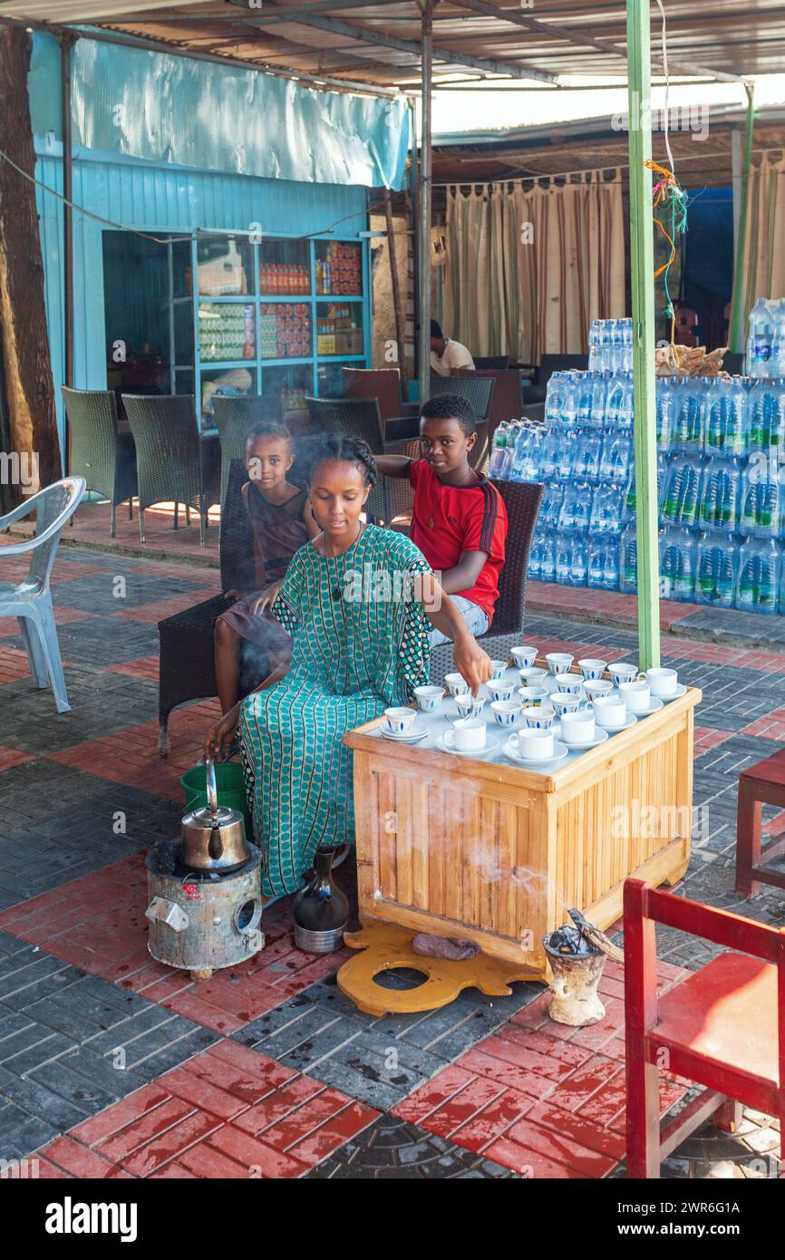 Melkasa, Ethiopia - April 27, 2019: Woman perform a traditional Ethiopian coffee ceremony ...