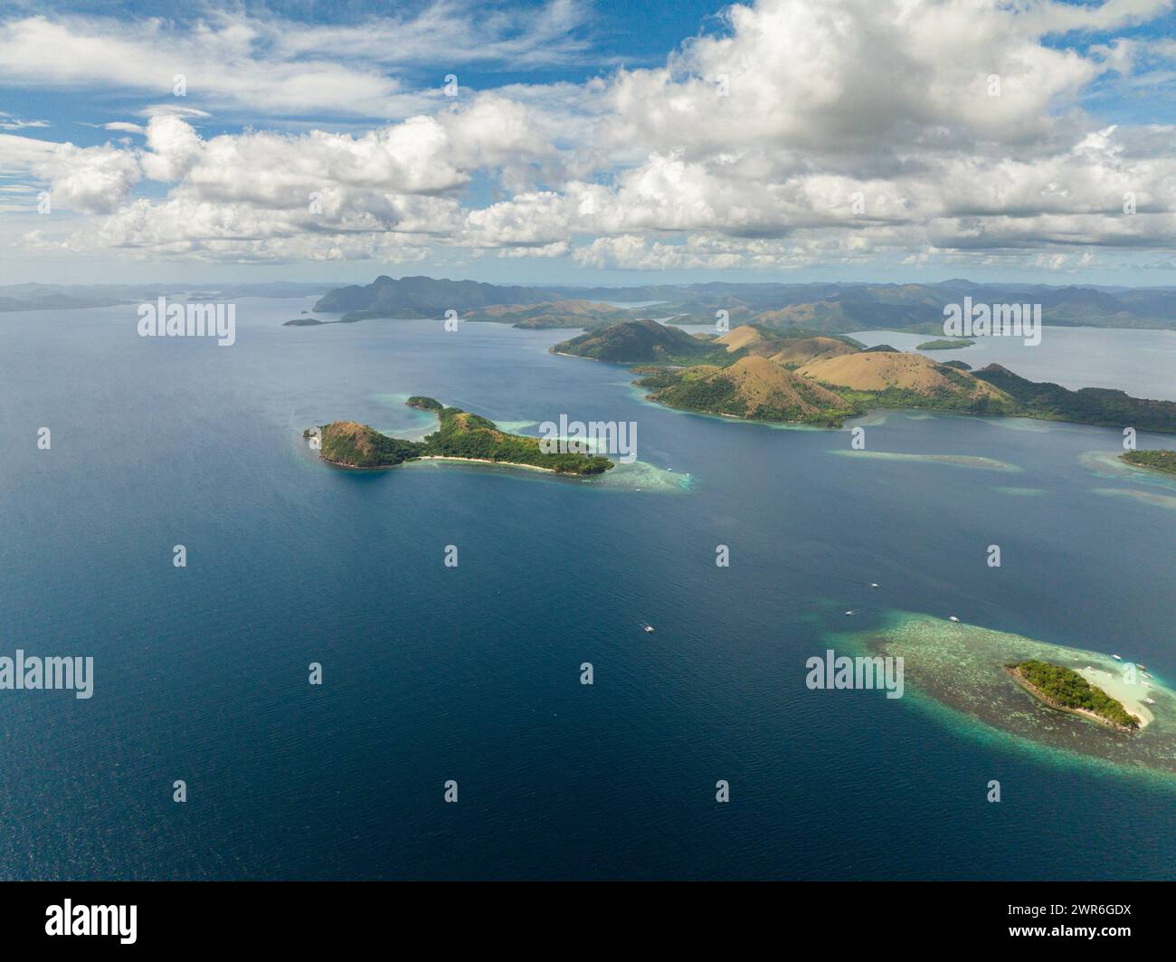 Boats around the Islands with corals and blue sea. Coron, Palawan ...