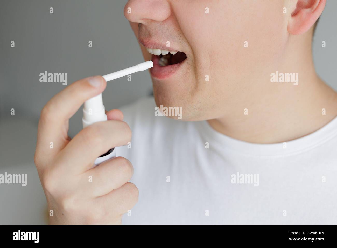Man using mouth spray hi-res stock photography and images - Alamy