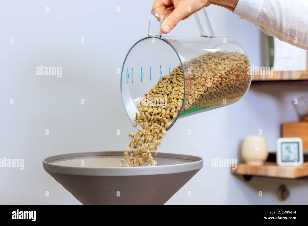 Process of roasting raw coffee beans in an oven, pouring raw coffee ...