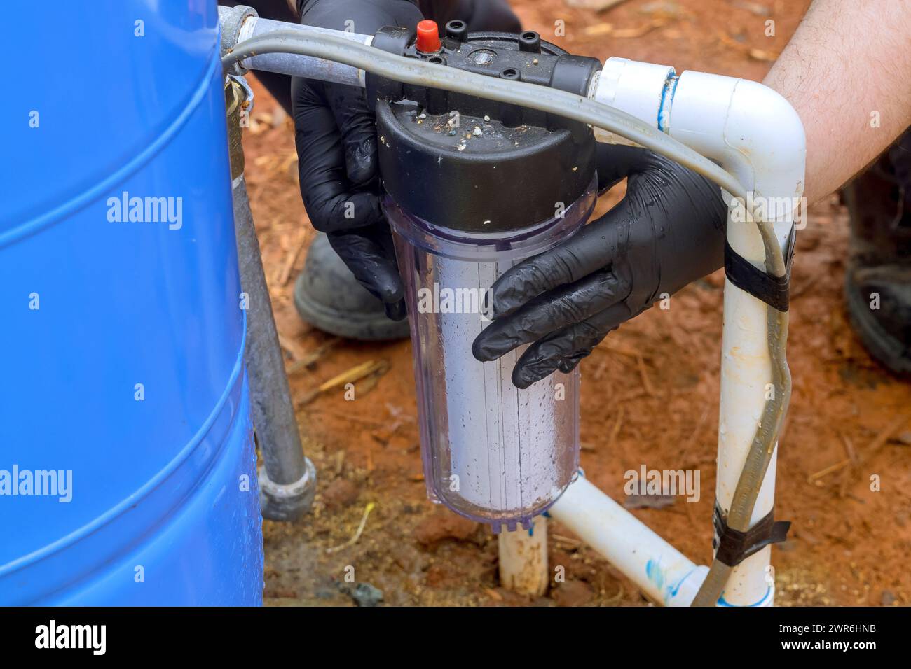 Installing water filter filtration hi-res stock photography and images ...