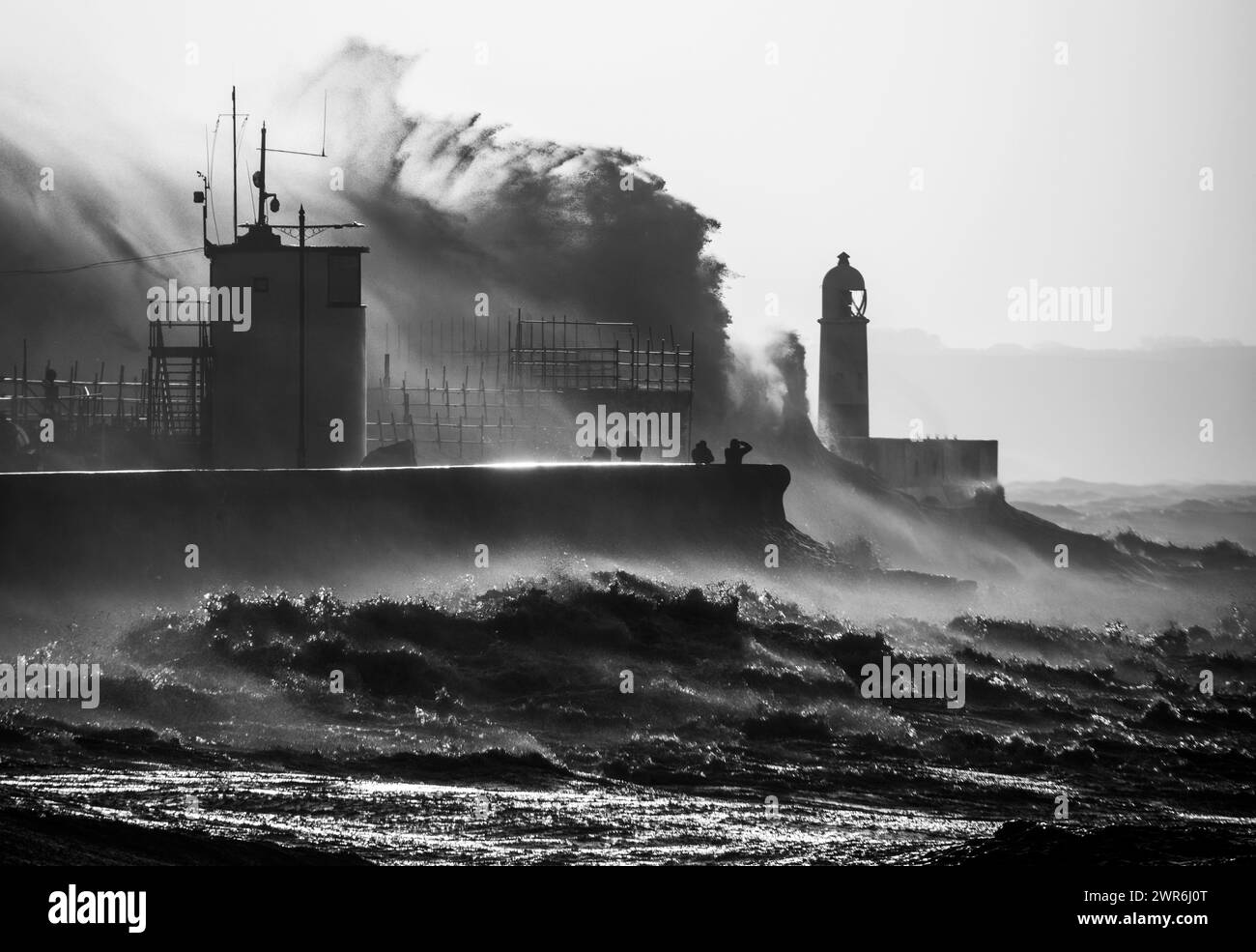 18/02/22 Photographers brave huge waves which crash over the 30ft-high ...