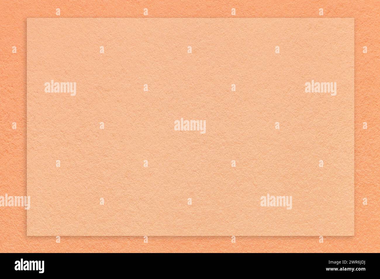 Color of year 2024. Texture of craft peach fuzz color paper background ...