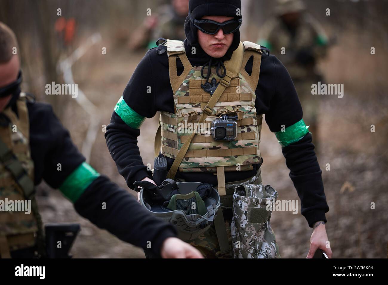 Young Ukrainian soldier wearing tactical ammunition for training on a ...