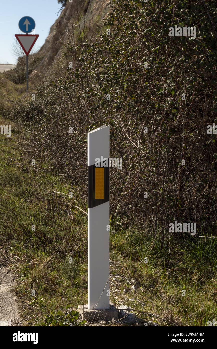 Corner bumps and traffic signs on a conventional road Stock Photo - Alamy