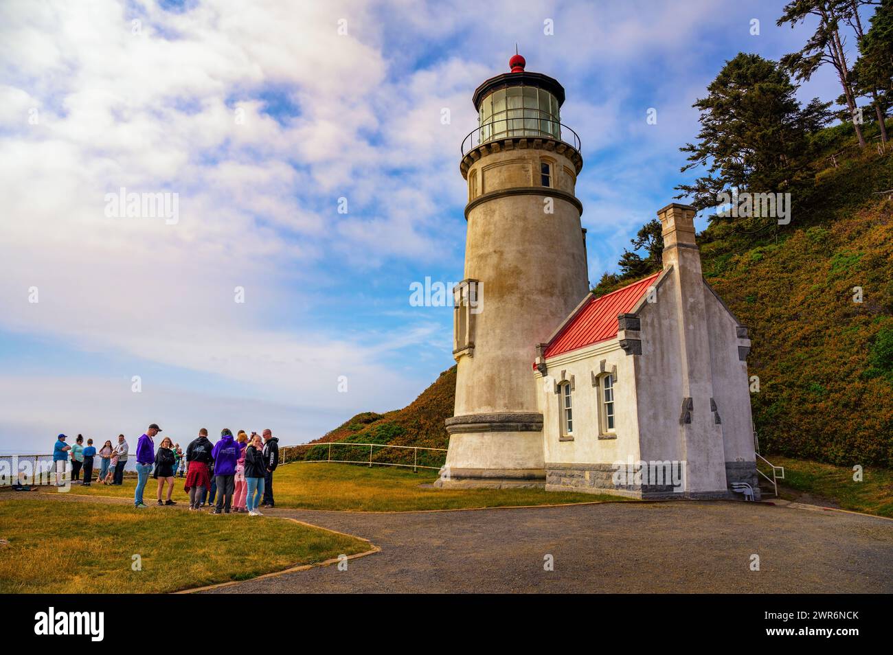 Group of tourists visit Heceta Head Lighthouse at the scenic Oregon ...