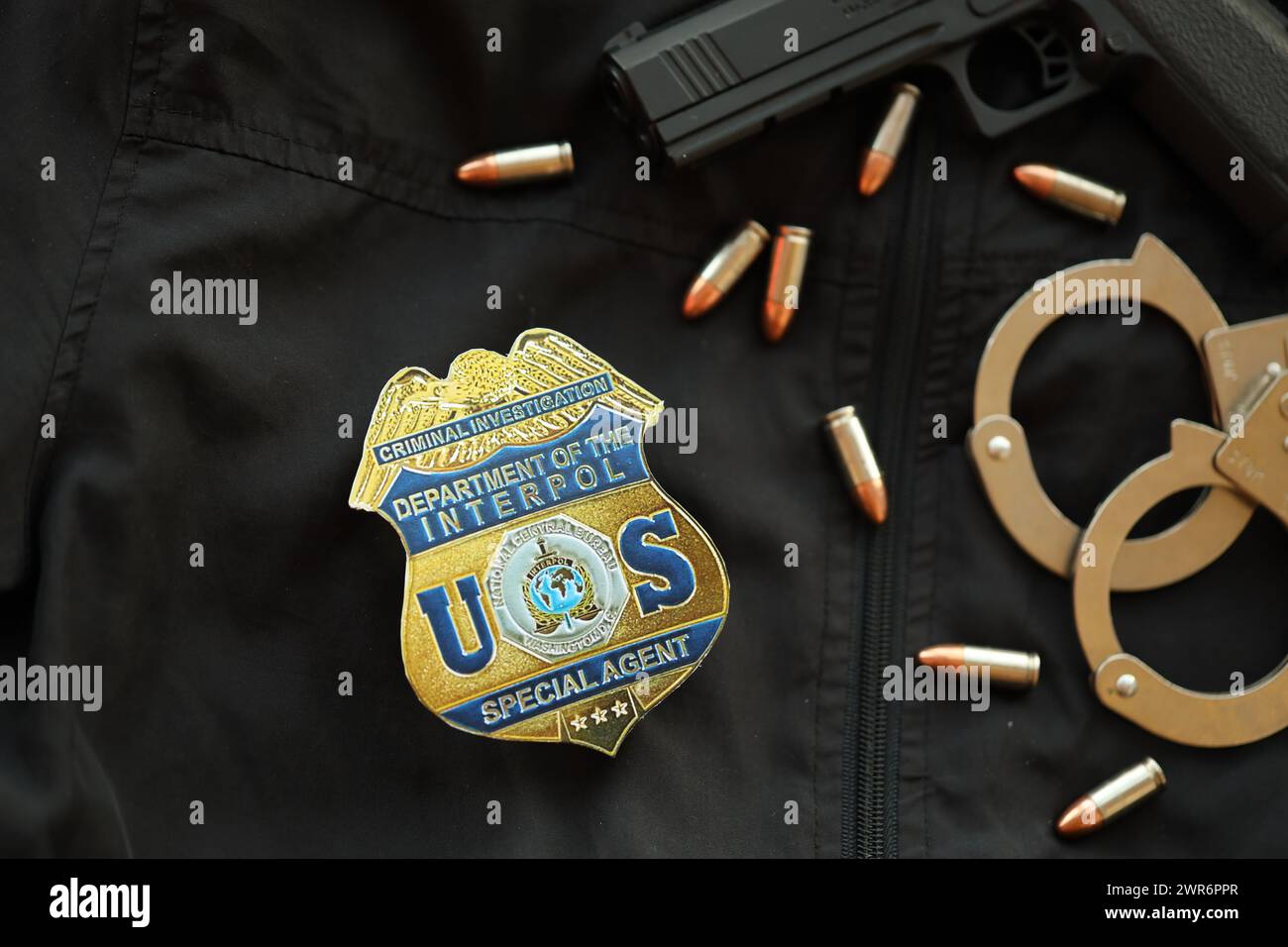 KYIV, UKRAINE - MARCH 9, 2024 US Interpol Special Agent badge on black ...