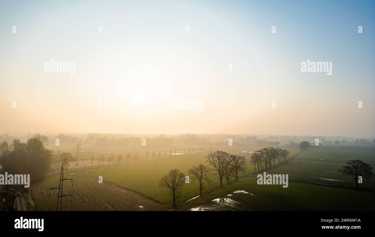 Drone over misty sunlit landscape hi-res stock photography and images ...
