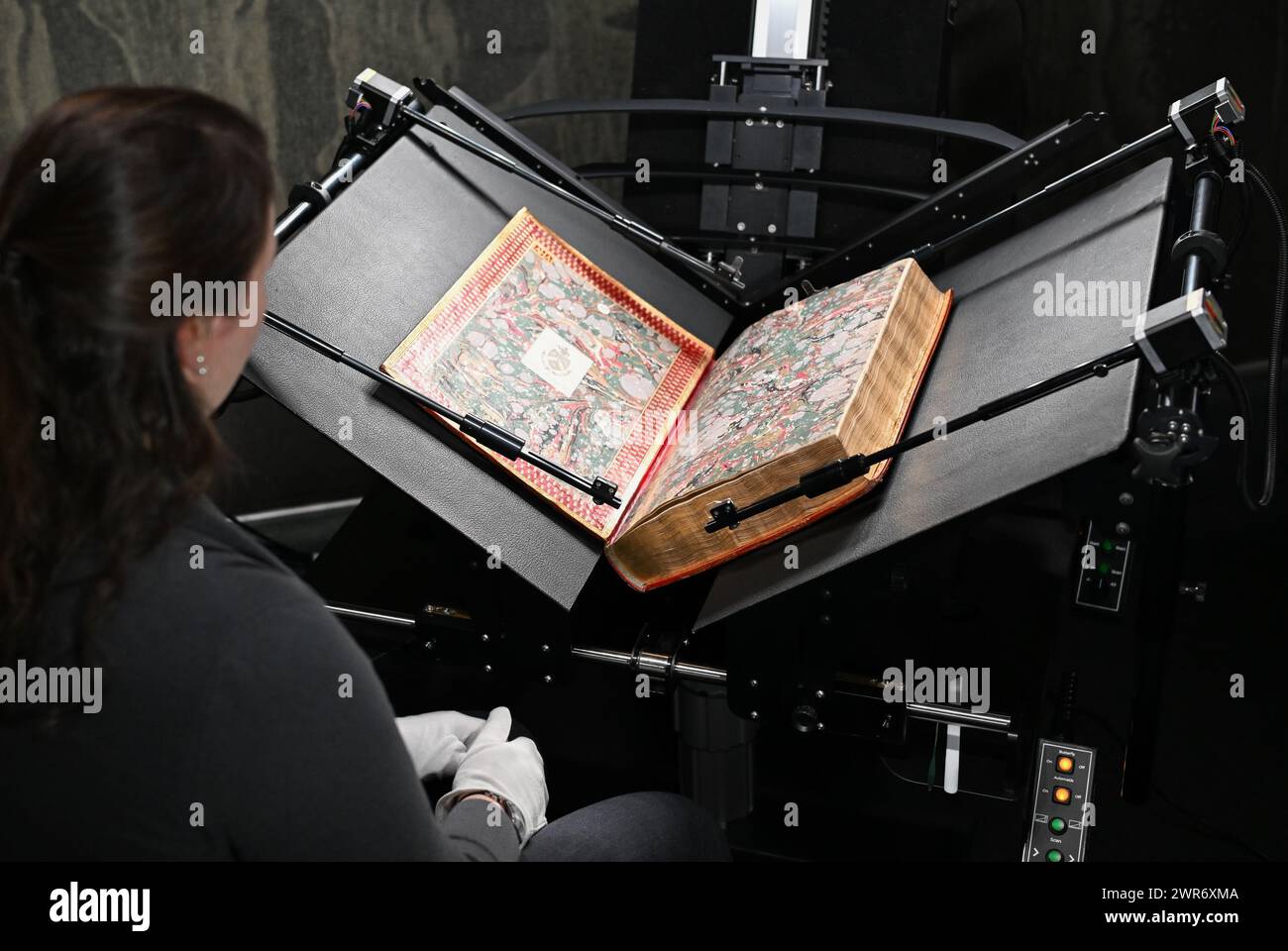 Mainz, Germany. 11th Mar, 2024. Dorothea Müller, conservator at the Gutenberg Museum, sits in ...