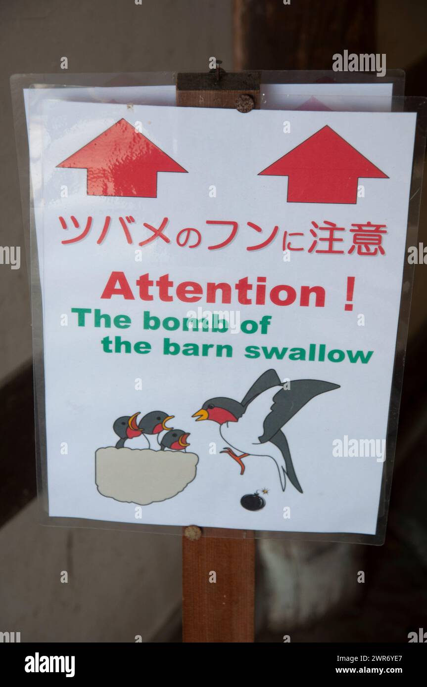 A warning sign from Japan warning about nesting Swallows Stock Photo ...