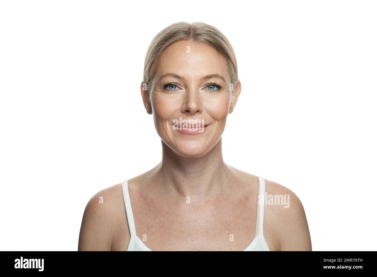 Cheerful mid adult woman with healthy aging skin and natural makeup ...