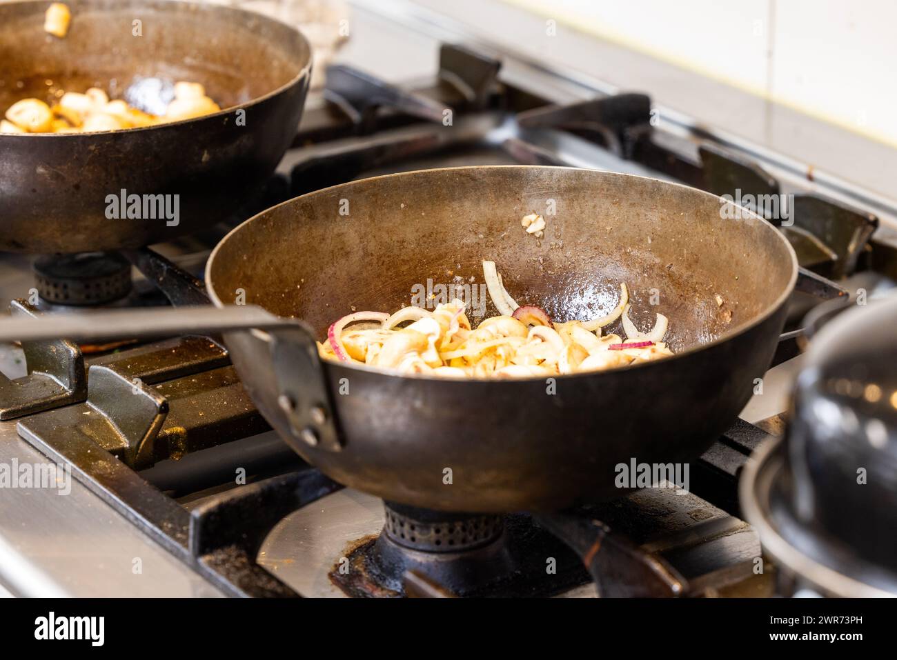 This image gives a behind-the-scenes look at a commercial kitchen with ...
