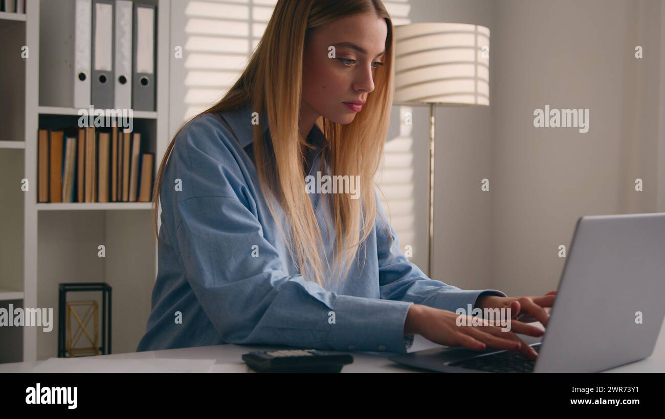 Caucasian woman using calculator laptop app calculate costs business ... Caucasian woman using calculator laptop app calculate costs business ...