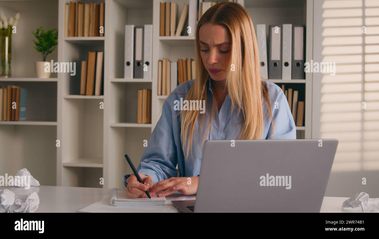 Caucasian female student girl studying working home office library ...
