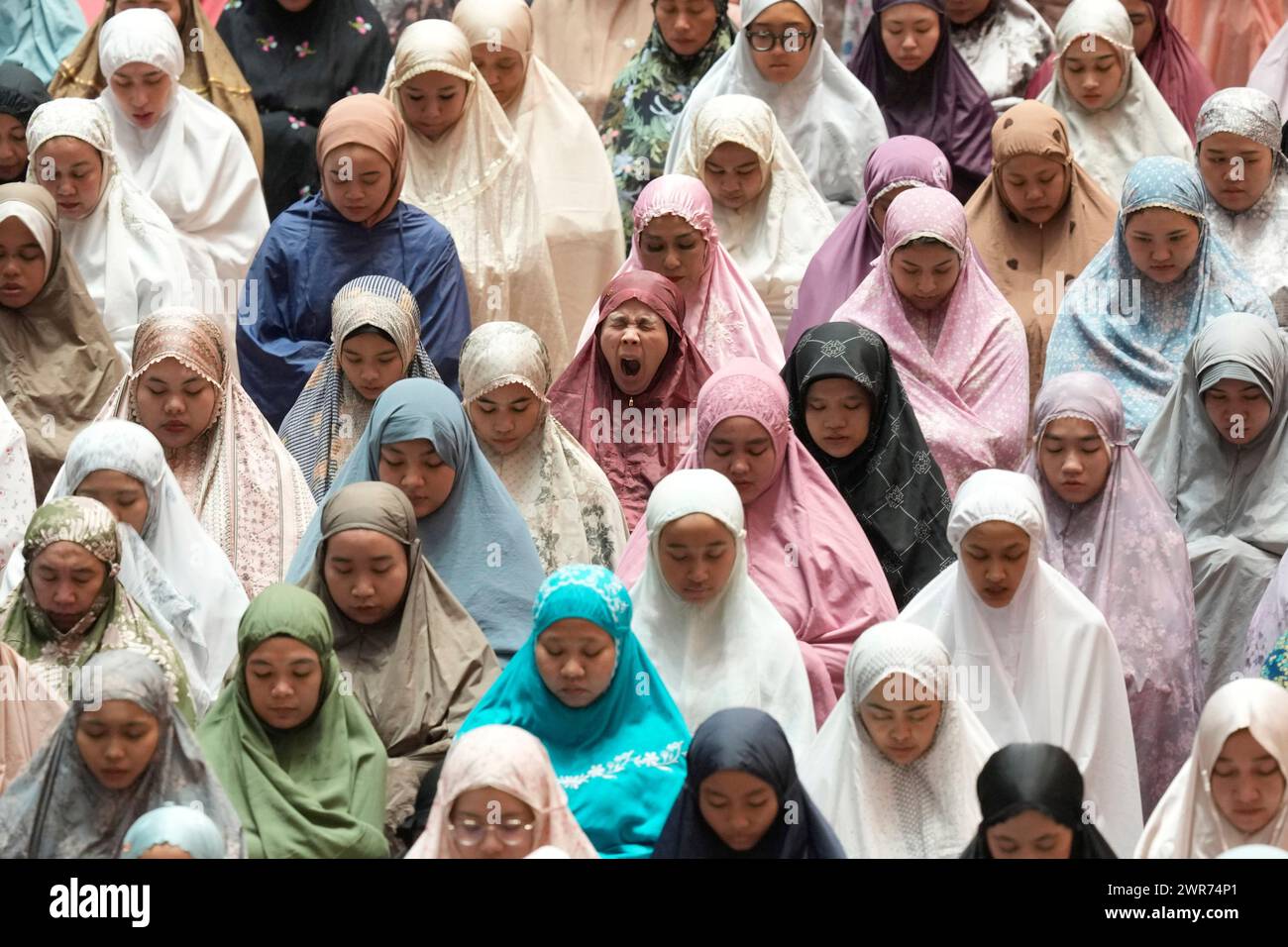 Indonesian Muslims attend an evening prayer called 'tarawih' marking ...