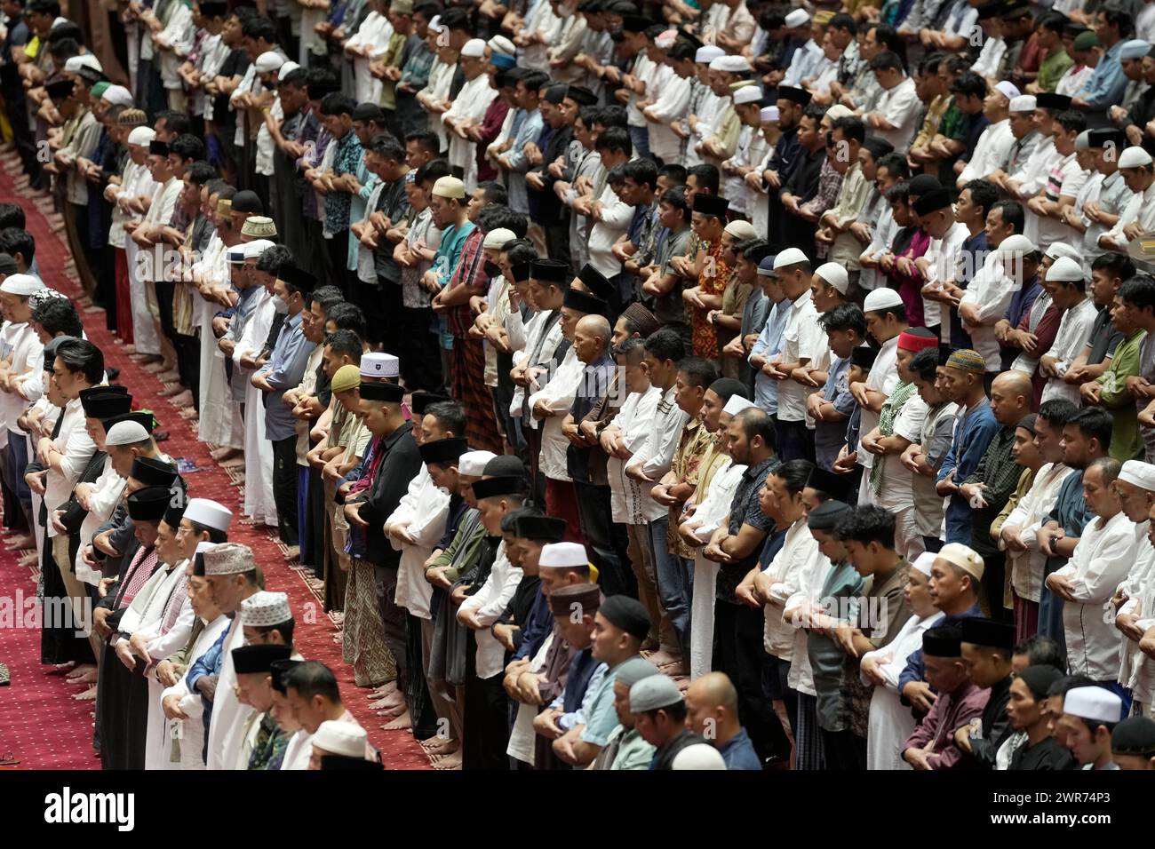 Indonesian Muslims attend an evening prayer called 'tarawih' marking ...