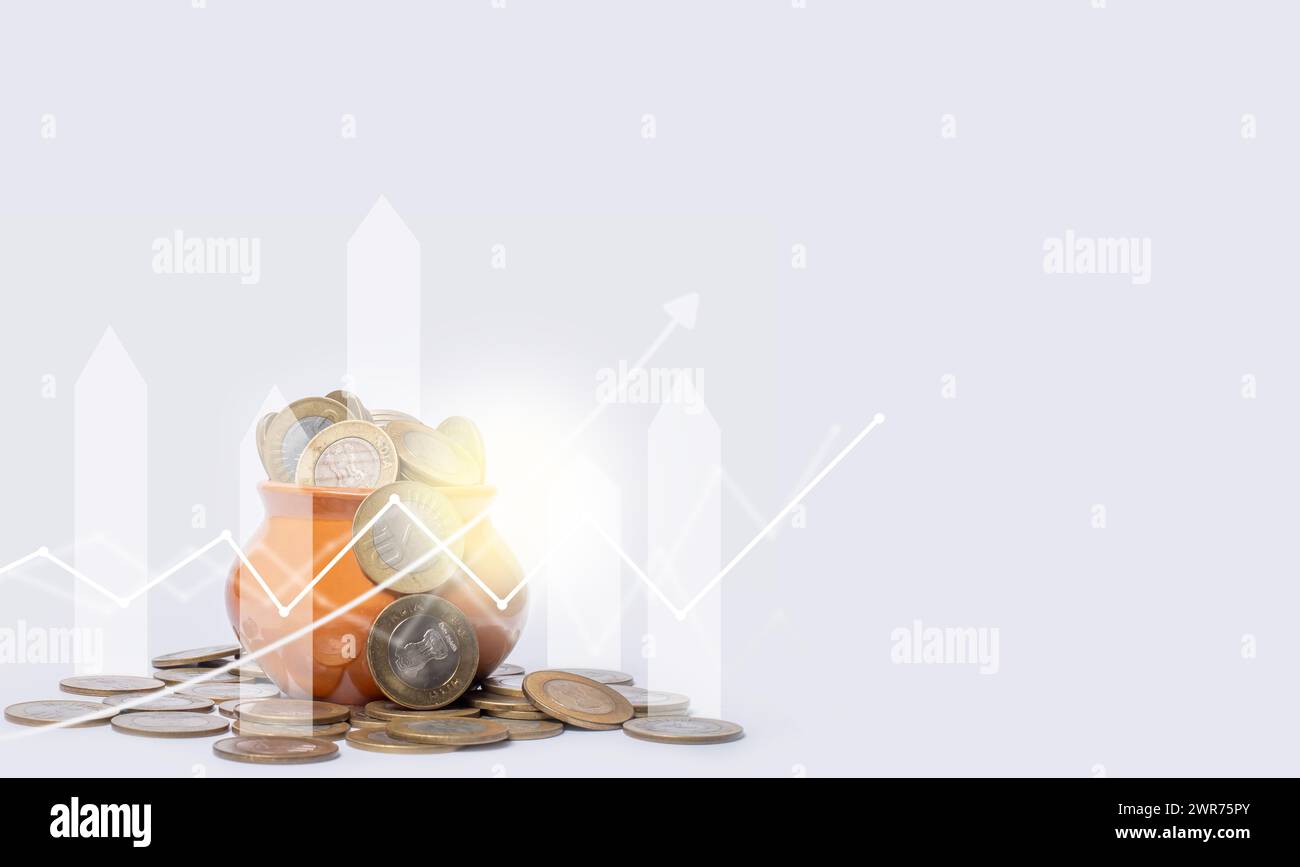Investment concept, coins in a clay pot with growing business graph on ...