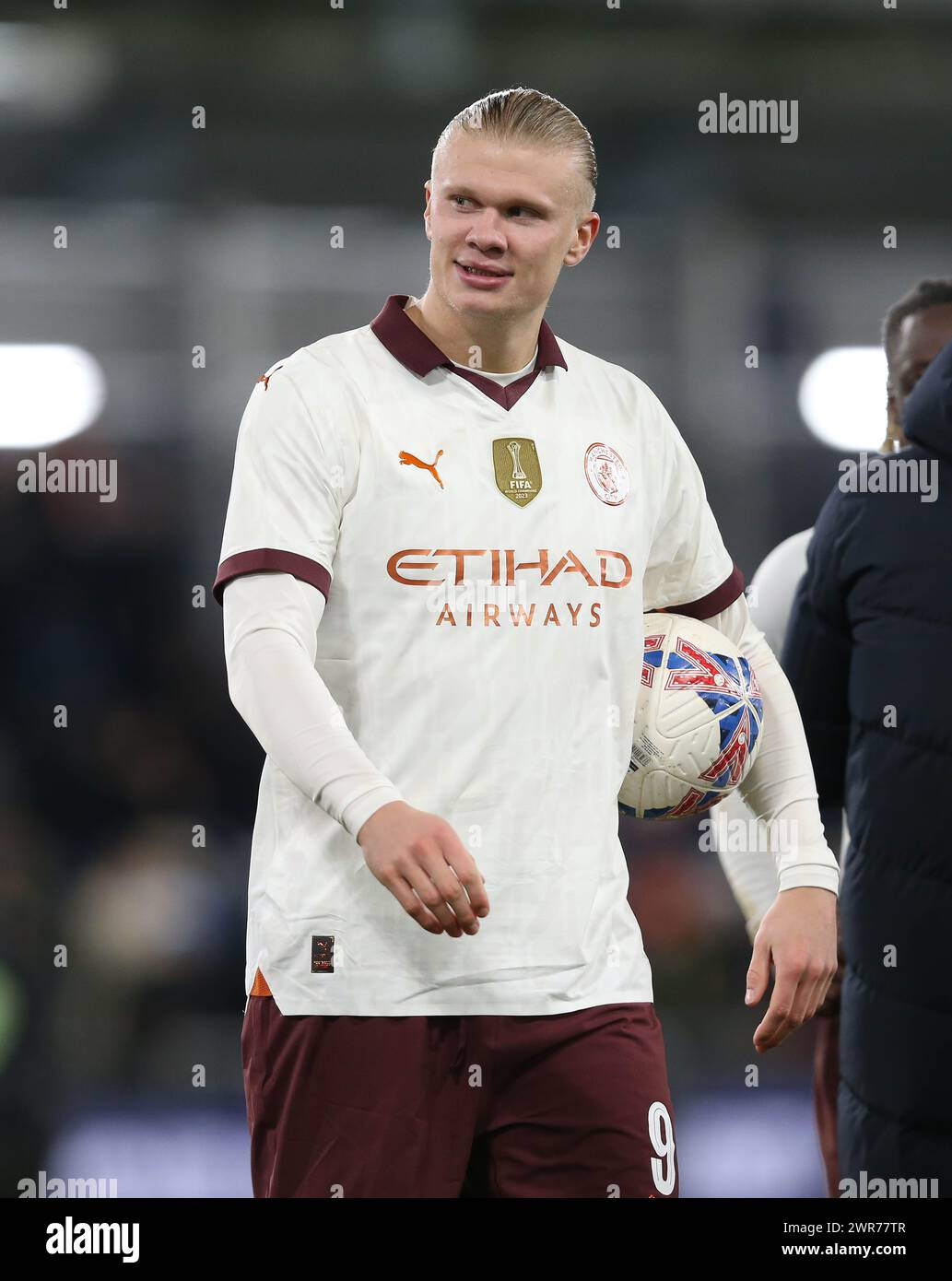 Erling Haland of Manchester City walks off the pitch holding the match ...