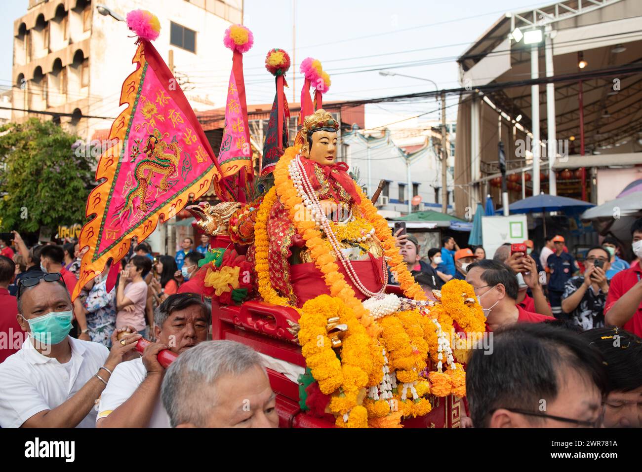 Bangkok, Thailand. 10th Mar, 2024. Believers parade a statue replica of ...
