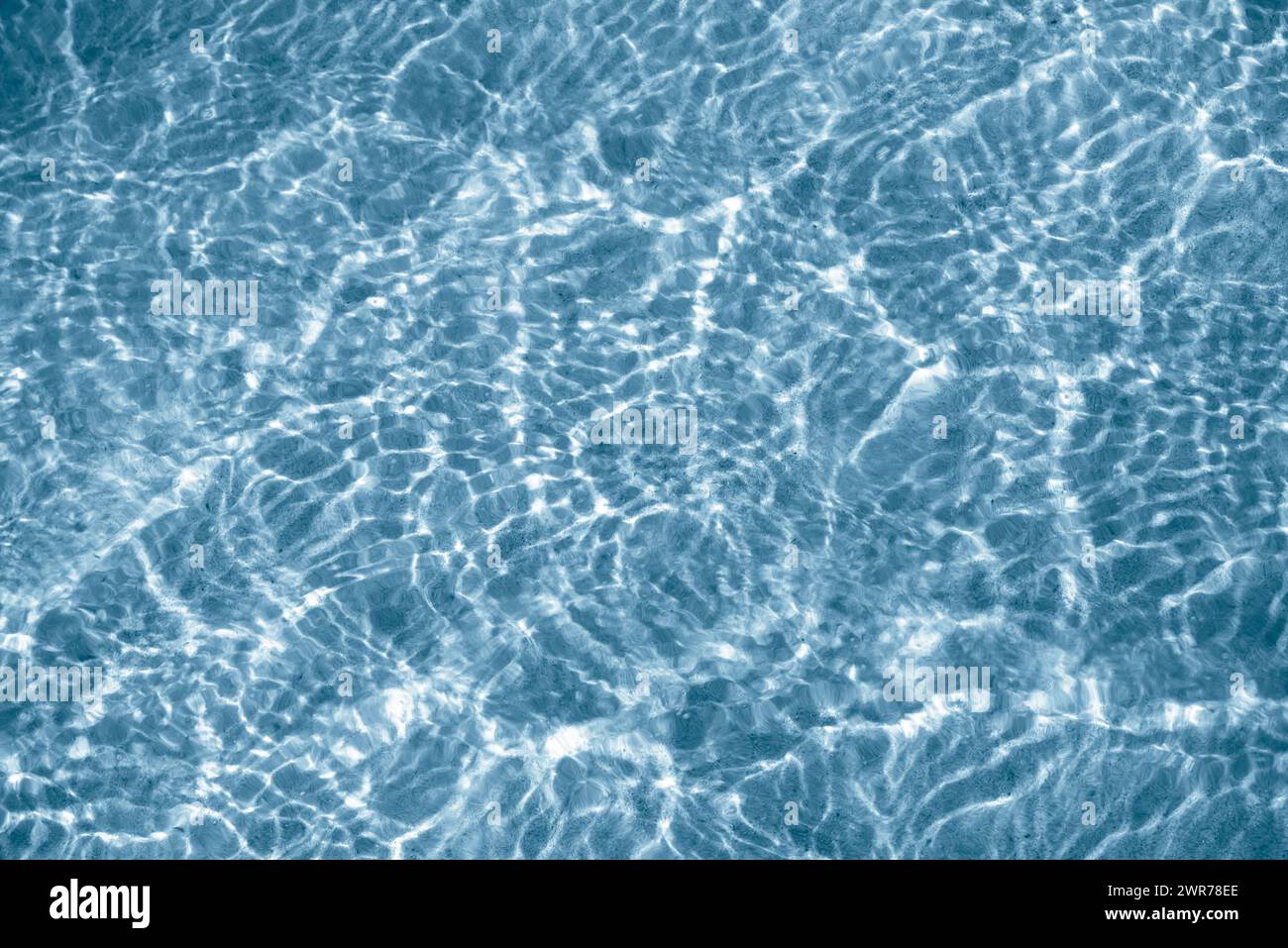 Underwater shallow waves rippling bright blue water in a sea background ...