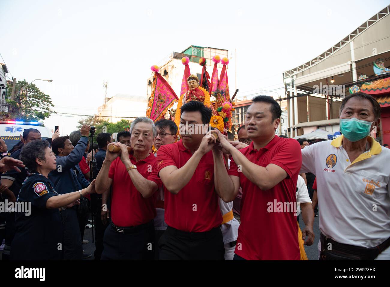 Bangkok, Thailand. 10th Mar, 2024. Believers parade a statue replica of ...