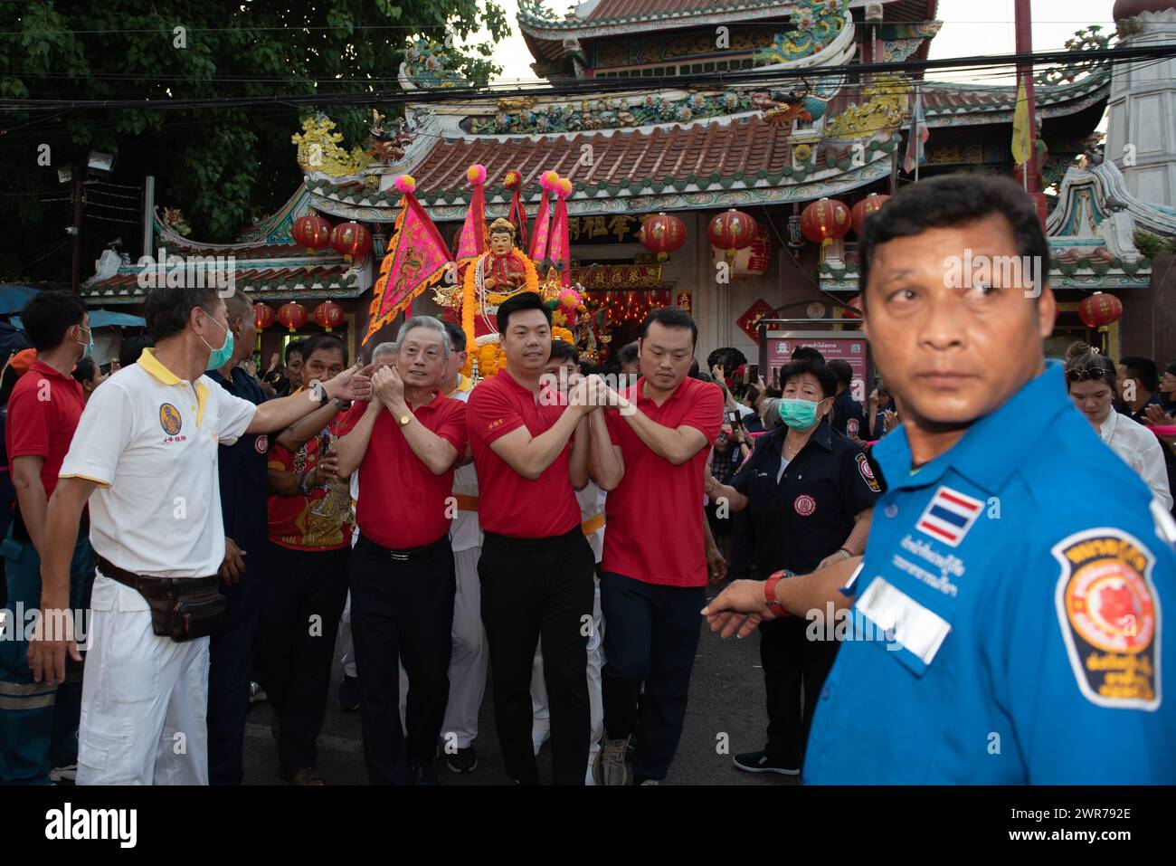 Bangkok, Thailand. 10th Mar, 2024. Believers parade a statue replica of ...