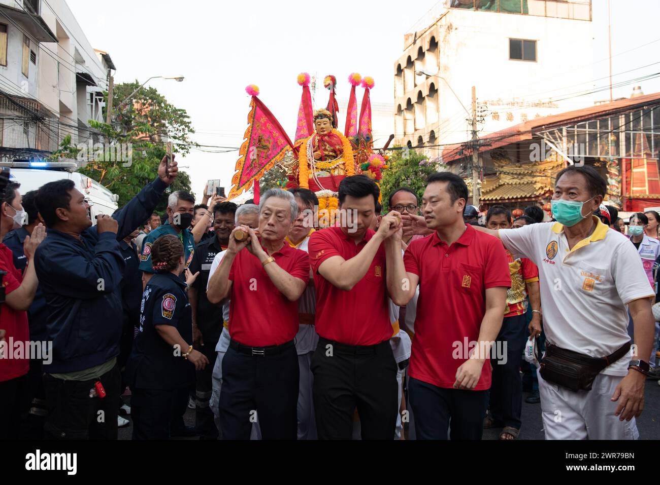 Bangkok, Thailand. 10th Mar, 2024. Believers parade a statue replica of ...