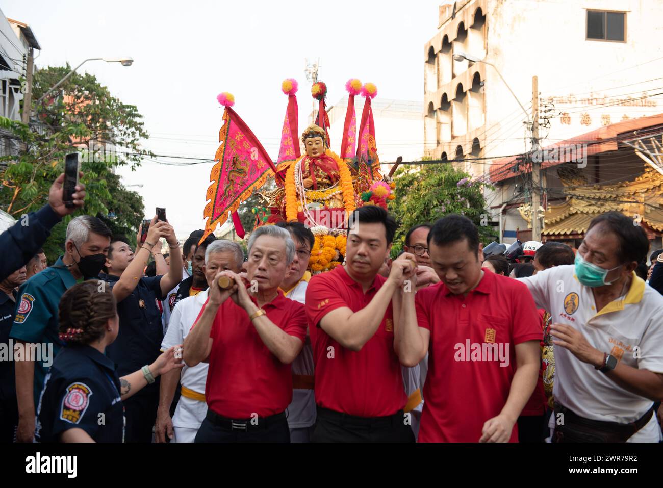 Believers parade a statue replica of Chao Mae Lim Ko Niao god, a deity ...
