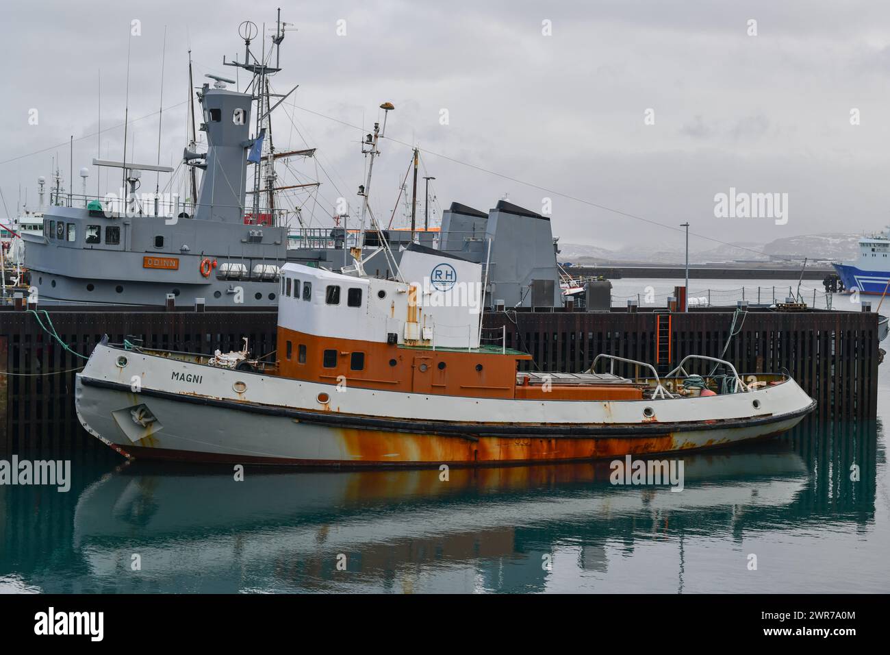Side view of the tugboat Magni alongside at Reykjavik Harbour, Iceland ...