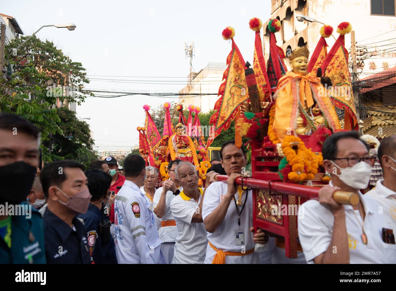 Bangkok, Thailand. 10th Mar, 2024. Believers parade a statue replica of ...