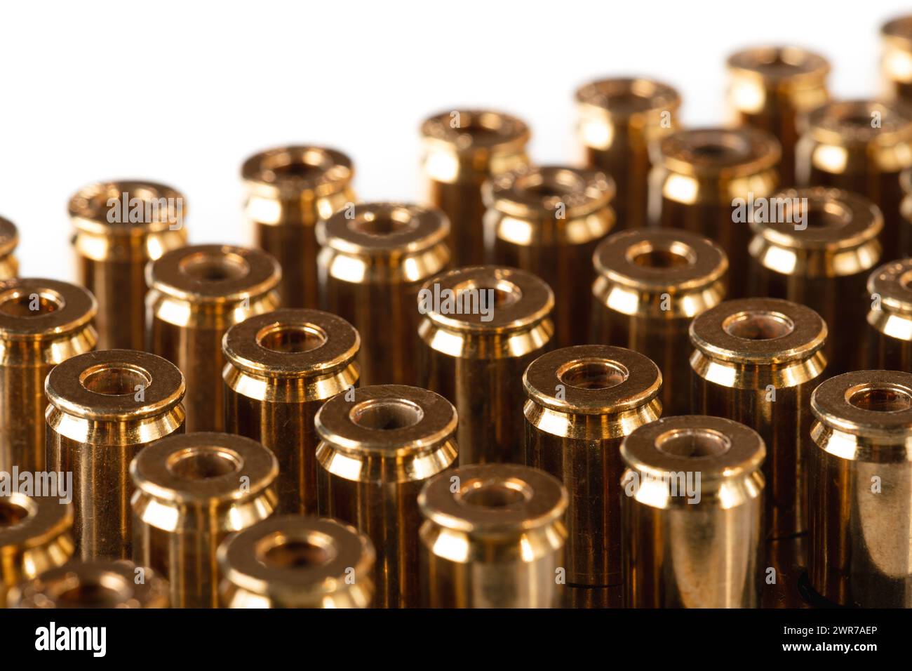 Golden bullet bottoms shell set pattern closeup white background Stock ...