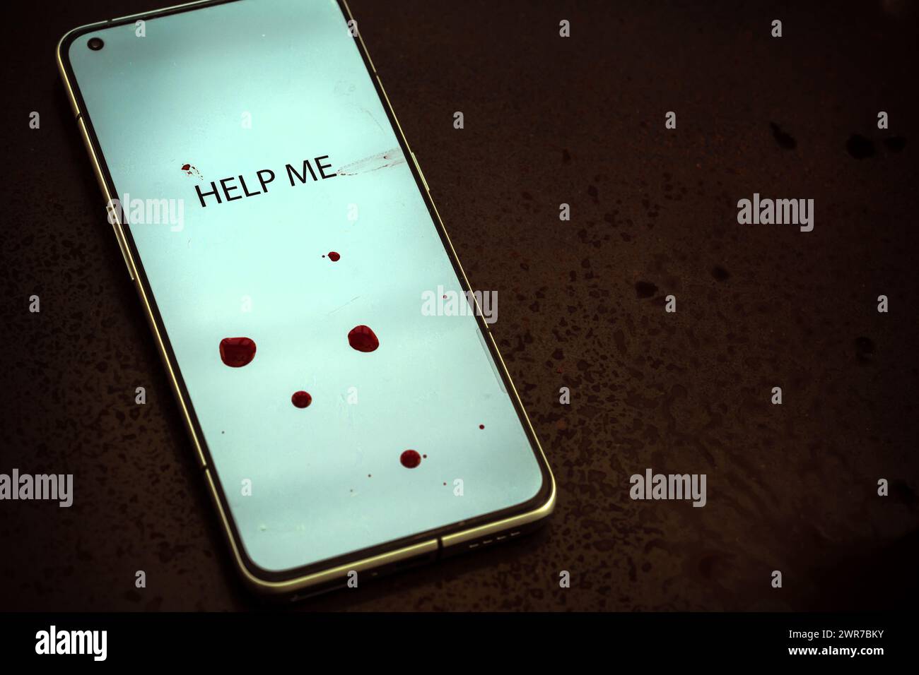 Image of help me words inscription on phone screen bloodstains splashes ...