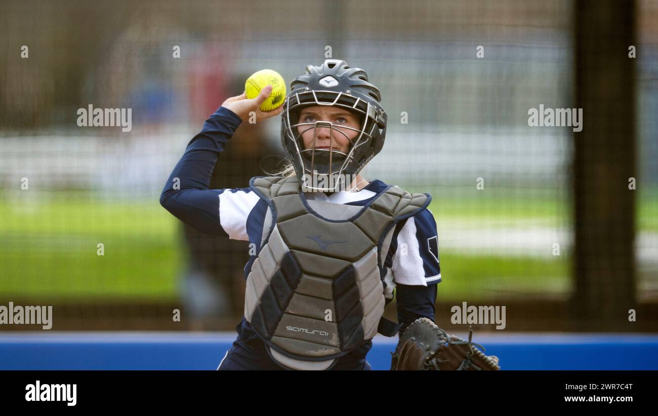 Nevada catcher Charli Hawkins (77) throws during an NCAA softball game ...
