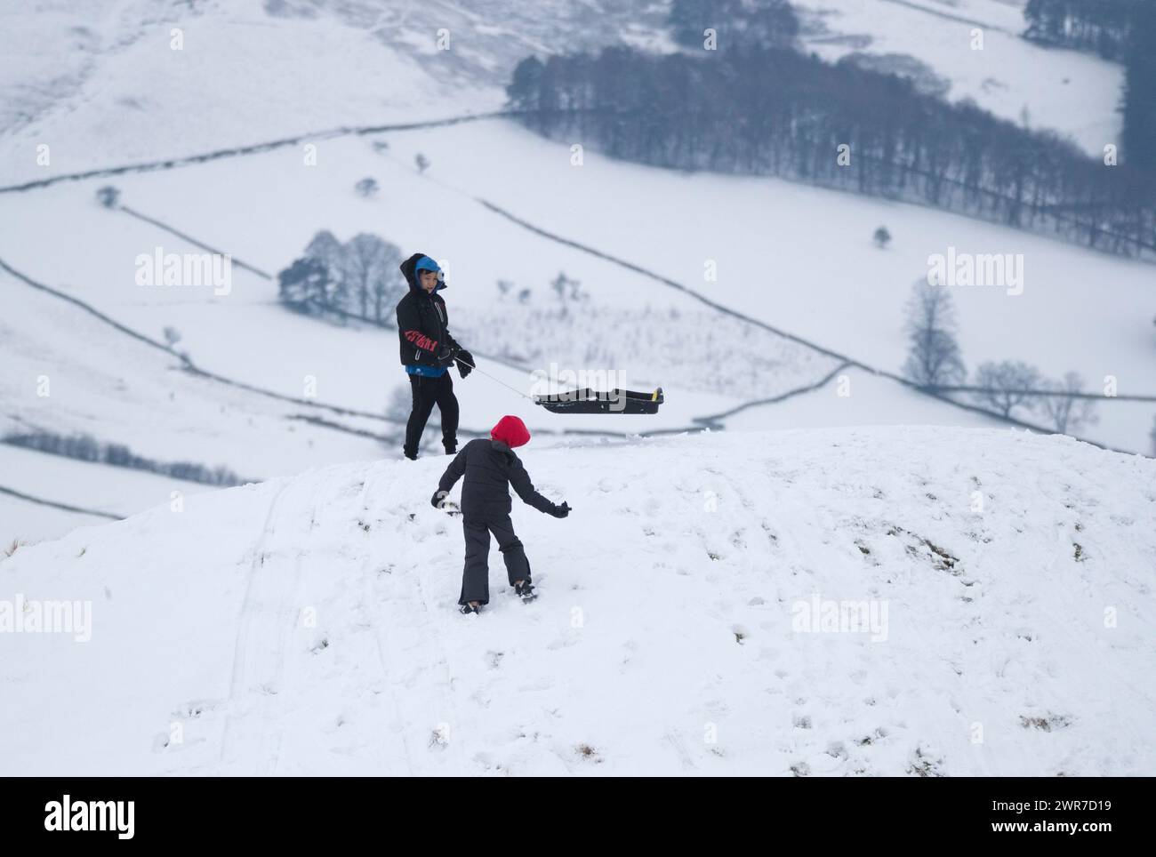29/12/17 Two young boys brave the high winds to go sledging above Edale ...