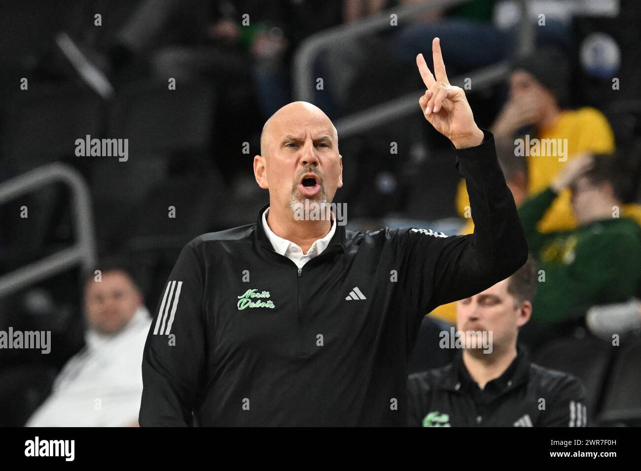 North Dakota Fighting Hawks head coach Paul Sather calls out a play ...