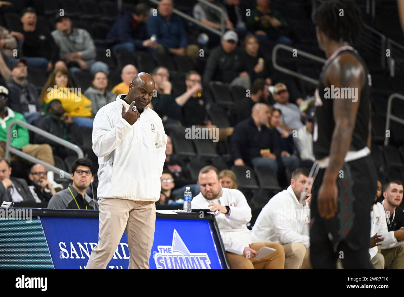 Nebraska-Omaha Mavericks head coach Chris Crutchfield summons one of ...