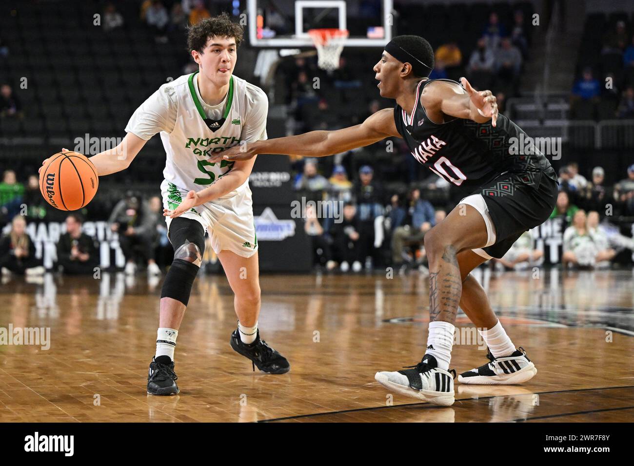 North Dakota Fighting Hawks guard Treysen Eaglestaff (52) looks to pass ...