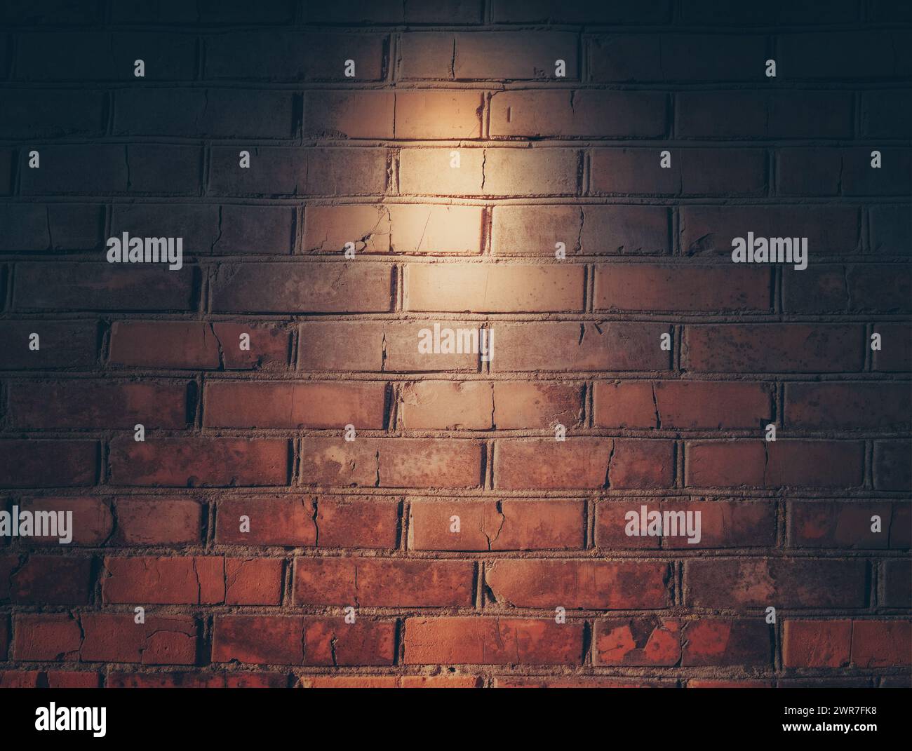 Spotlight on a brick wall. background with brick wall and spotlight ...