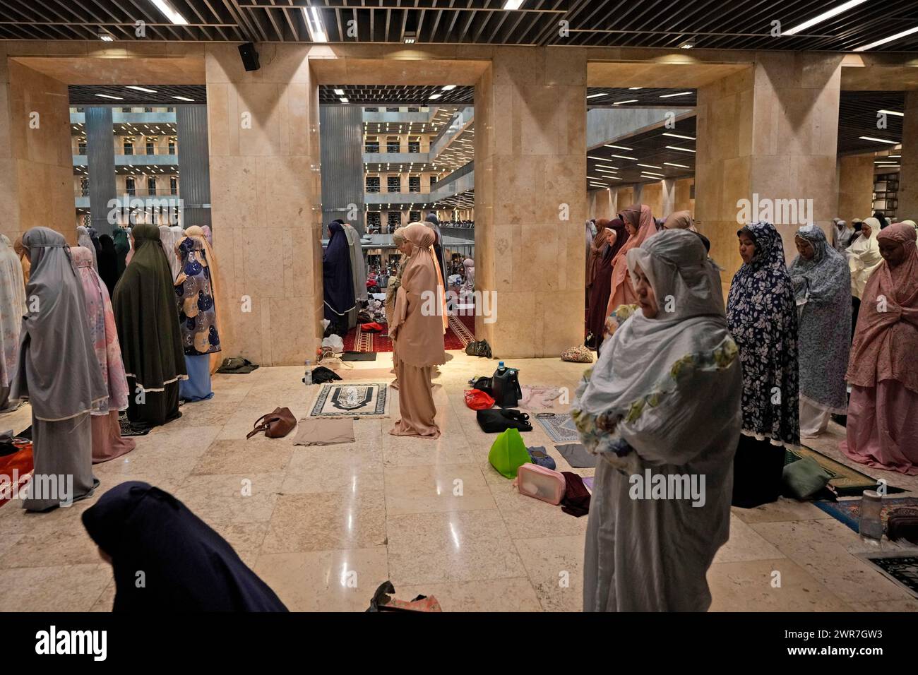 Indonesian Muslims perform an evening prayer called 'tarawih' marking ...