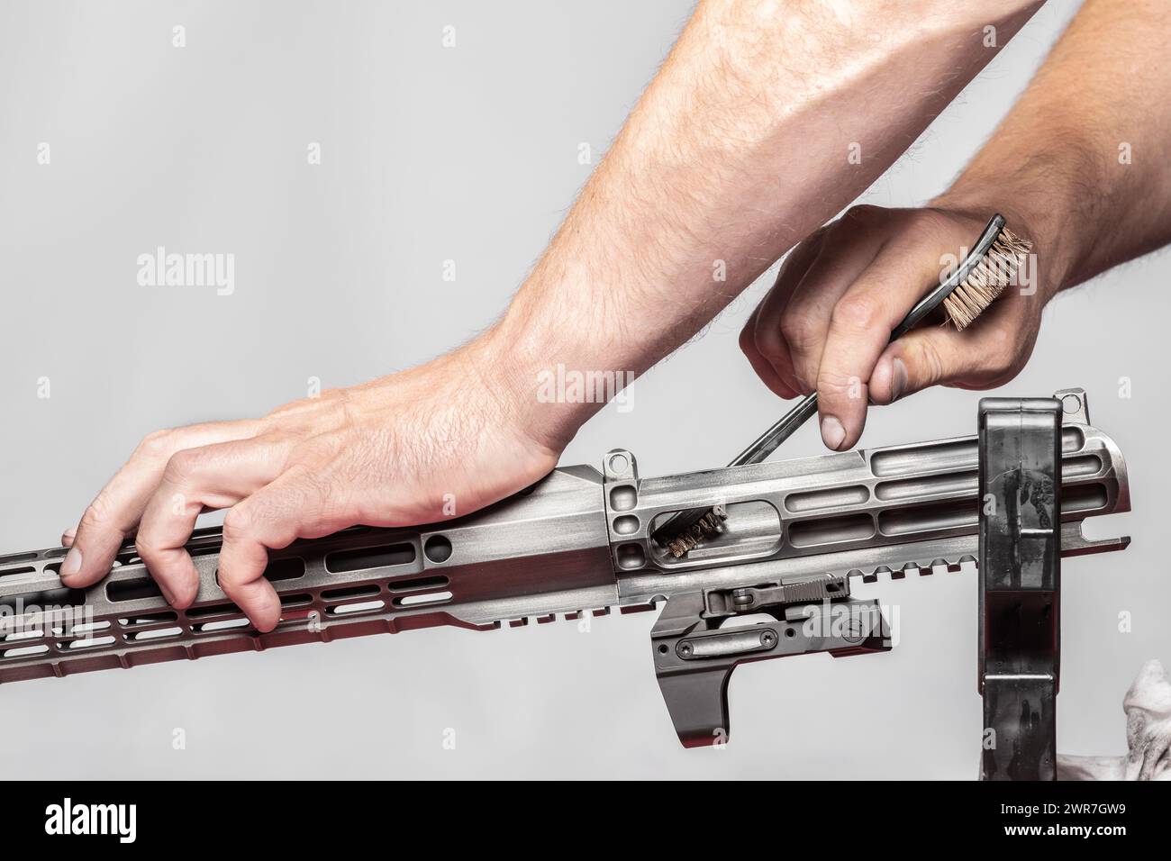 Mans hand holding gun hi-res stock photography and images - Alamy